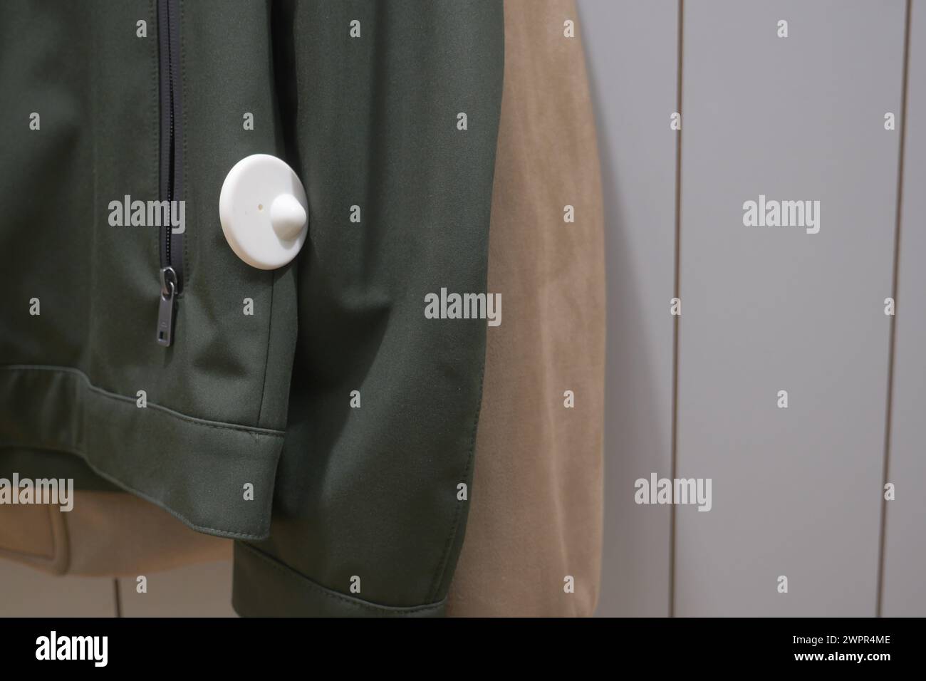 Security tags on clothes hi-res stock photography and images - Alamy