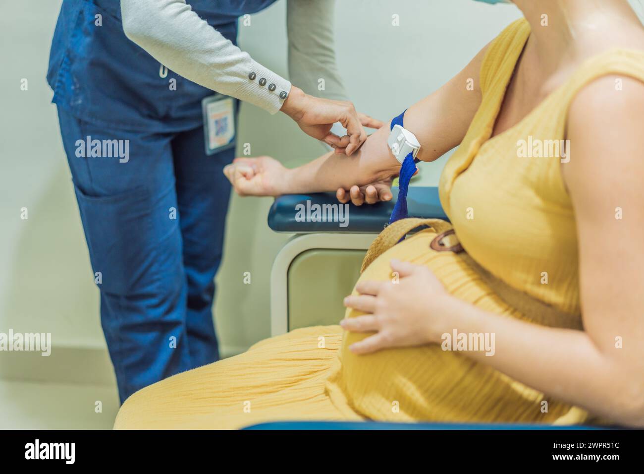 pregnant woman undergoes a blood test, a pivotal step in ensuring the ...