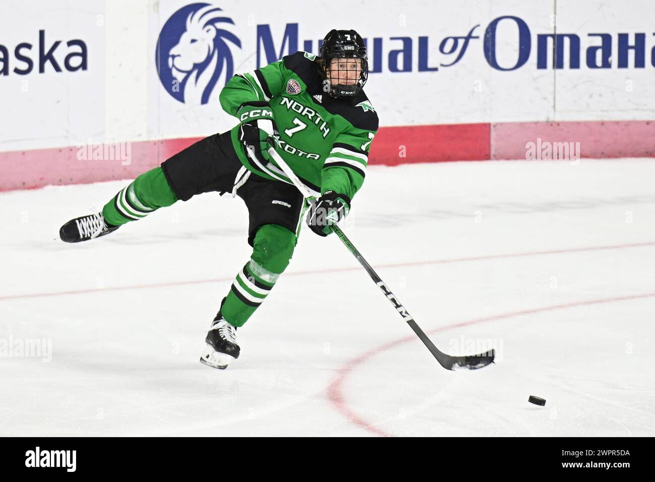 North Dakota Fighting Hawks defenseman Garrett Pyke (7) passes the puck during a NCAA men's ...