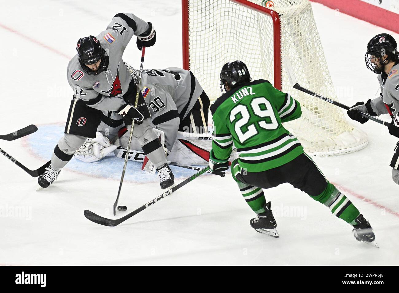 Omaha Mavericks defenseman Nolan Krenzen (12) clears the puck out from ...