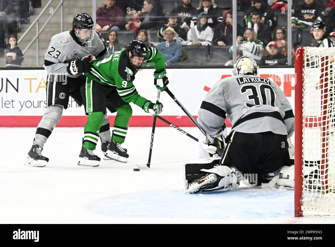 Omaha, USA. 08th Mar, 2024. North Dakota Fighting Hawks forward Jackson Blake (9) shoots on ...