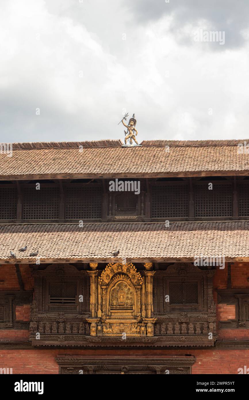Window carving details and the statue of lord Hanuman at the roof-top ...