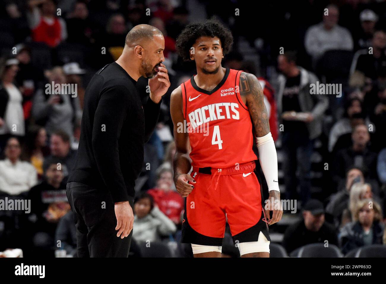Houston Rockets head coach Ime Udoka, left, speaks with Houston Rockets ...