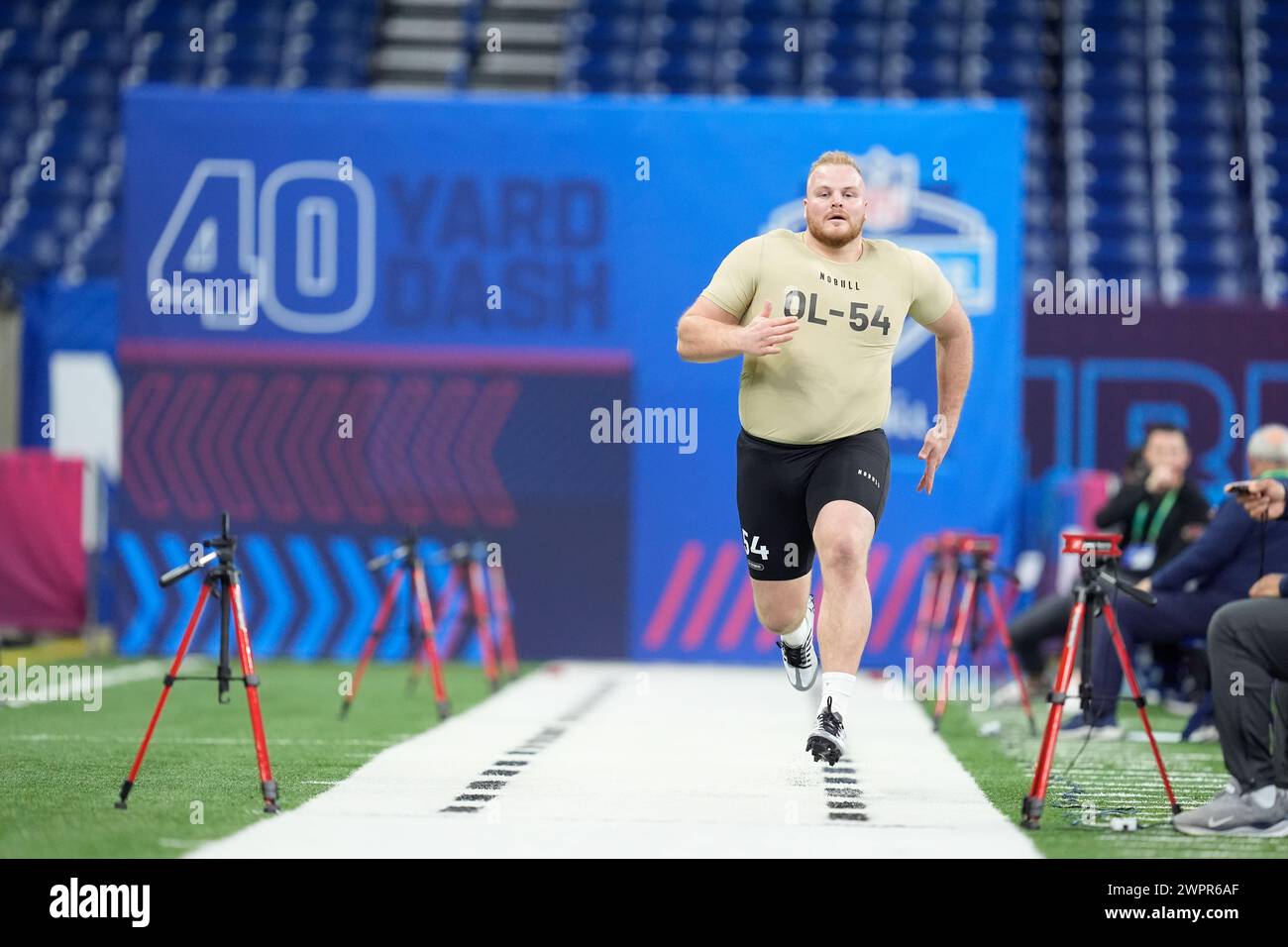 Michigan offensive lineman Drake Nugent runs a drill at the NFL ...