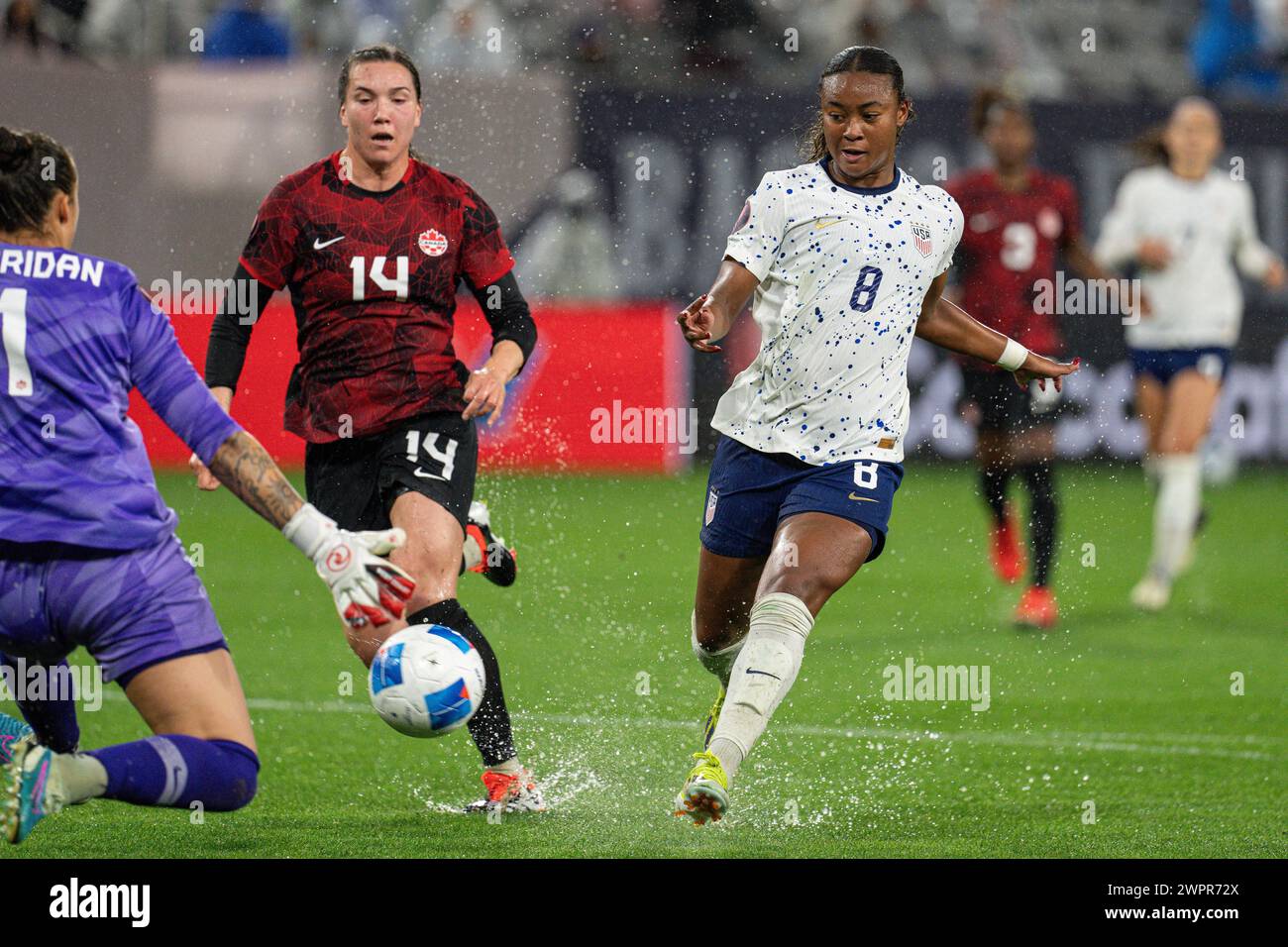 United States forward Jaedyn Shaw (8) scores against Canada goalkeeper ...