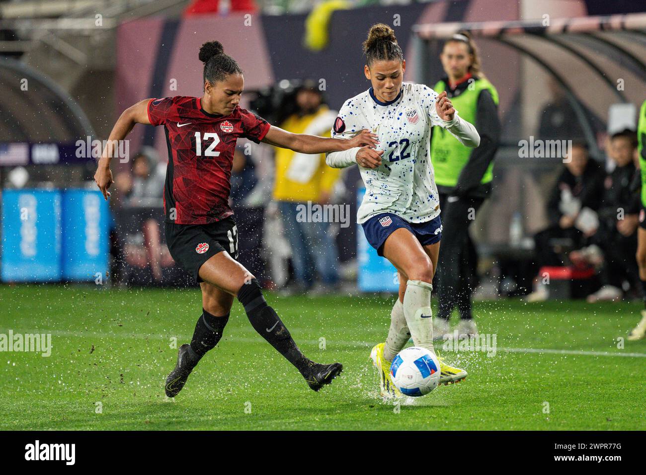 United States forward Trinity Rodman (22) is defended by Canada forward ...