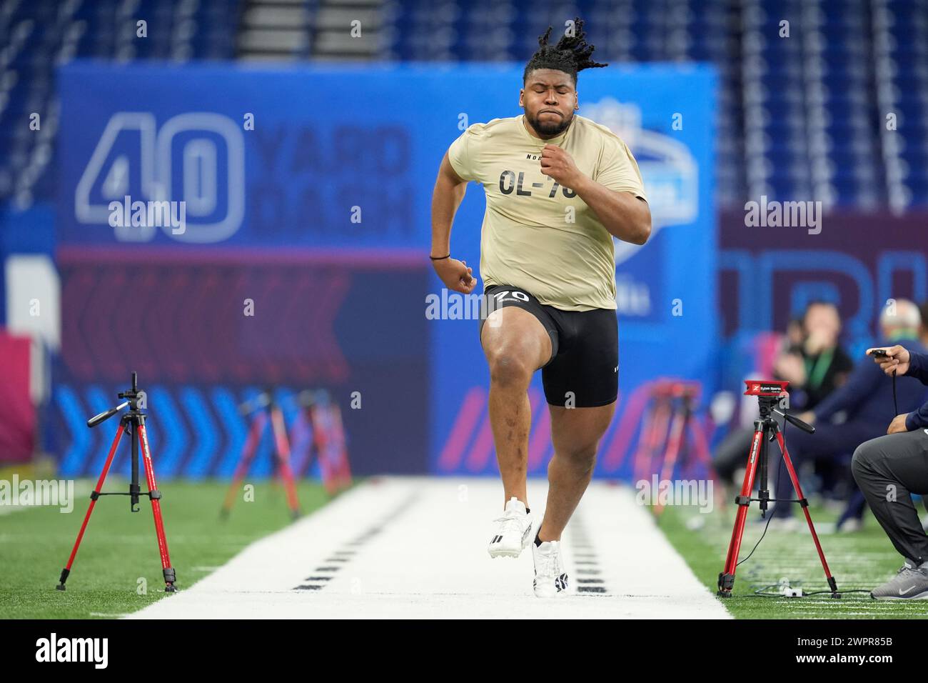 Penn State offensive lineman Caedan Wallace runs a drill at the NFL ...