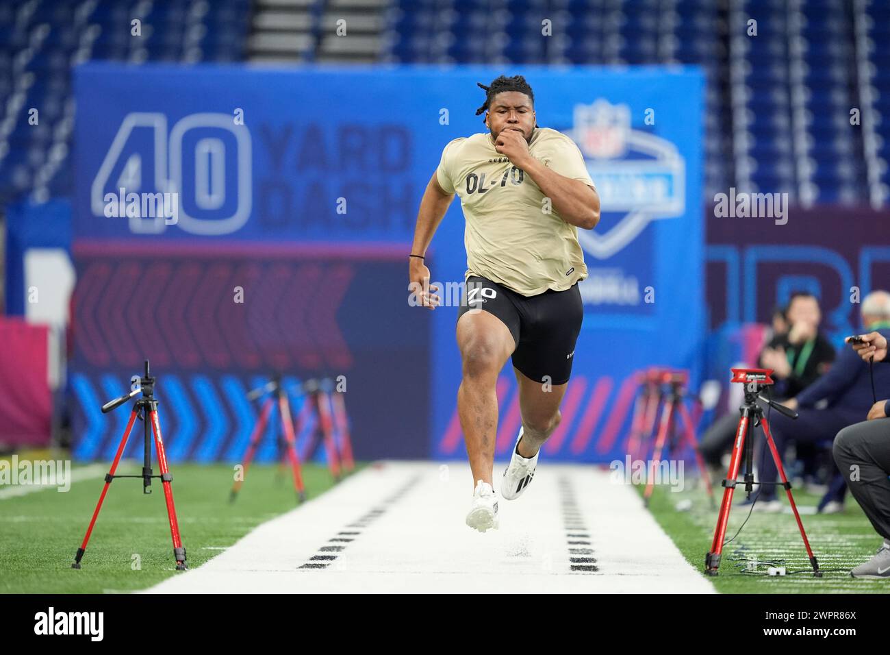 Penn State offensive lineman Caedan Wallace runs a drill at the NFL ...