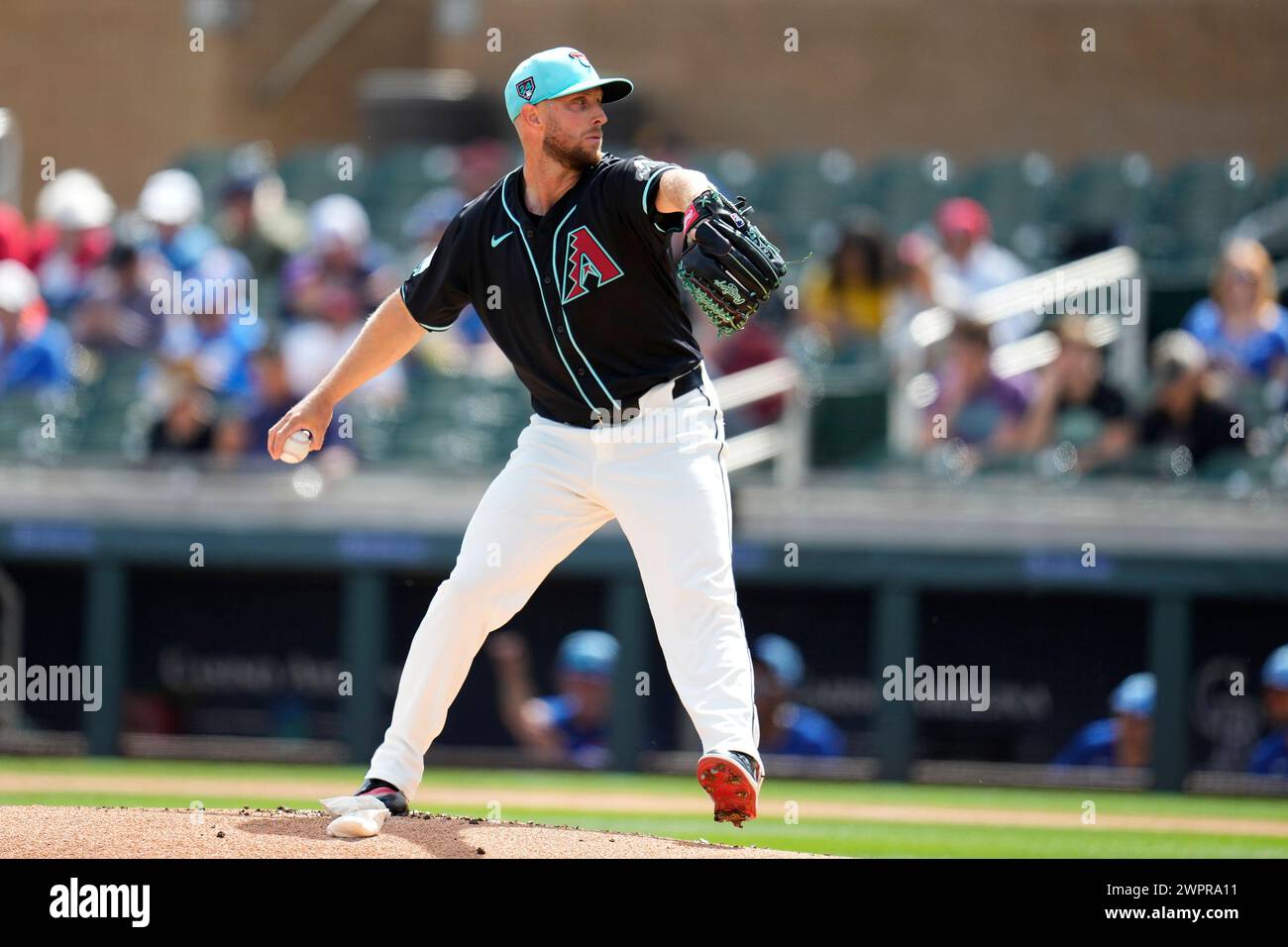 Arizona Diamondbacks pitcher Merrill Kelly warms up prior to a spring ...