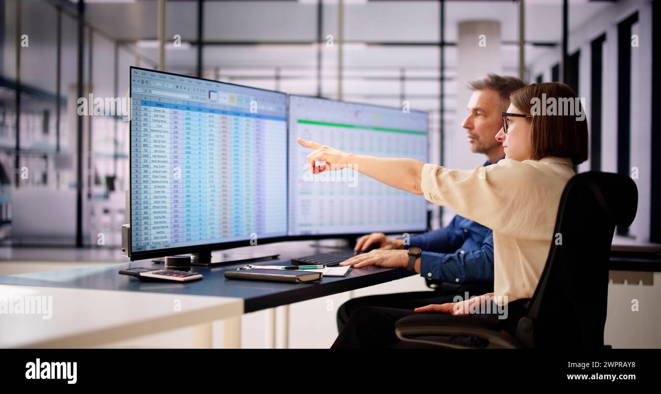 Analyst Employee Working On Spreadsheet Using Desktop Computer Stock ...