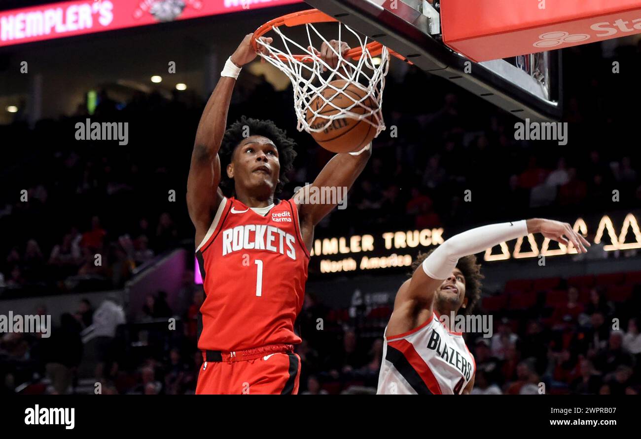 Houston Rockets forward Amen Thompson (1) dunks the ball on Portland ...