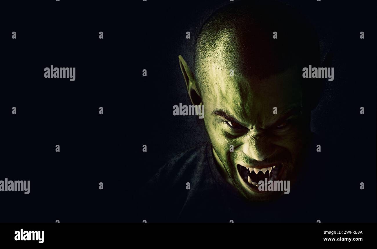 Monster, man and devil face in studio for fantasy, horror and angry ...