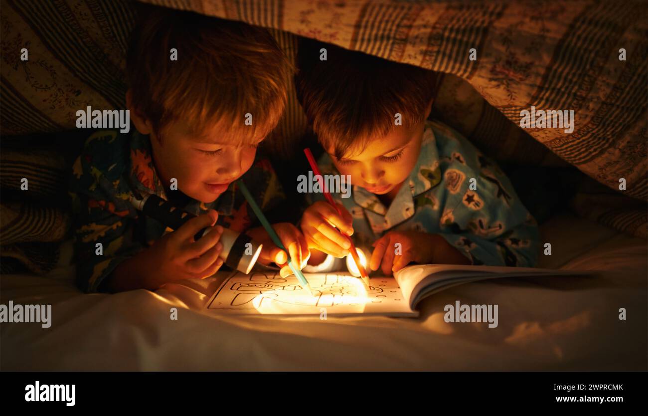 Reading book at night with a torch hi-res stock photography and images ...