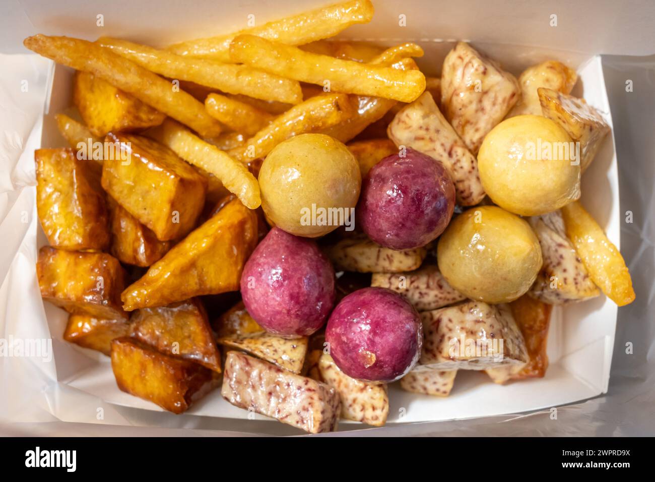 Candied sweet potato, taro, french fries and sweet potato balls Stock ...