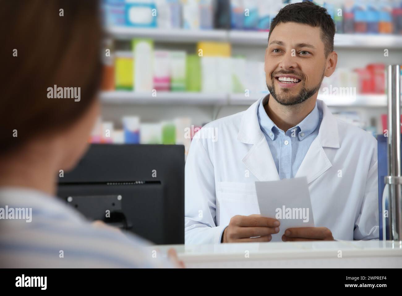 Professional pharmacist working customer hi-res stock photography and ...