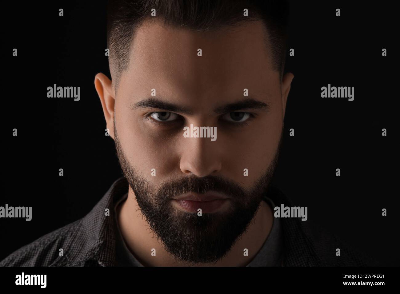 Evil eye. Man with scary eyes on black background Stock Photo - Alamy