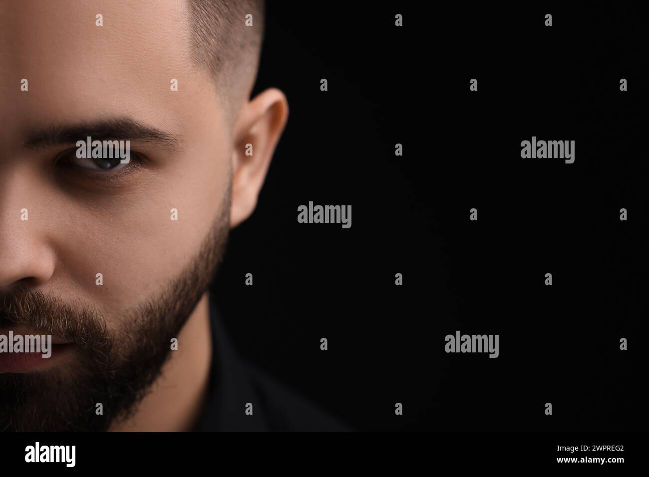 Evil eye. Man with scary eyes on black background, space for text Stock ...