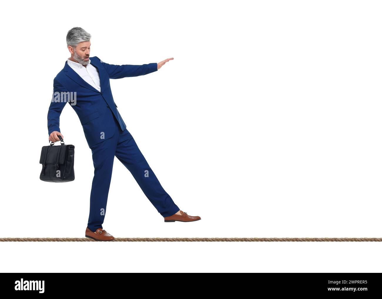 Risks and challenges of owning business. Man with briefcase balancing ...