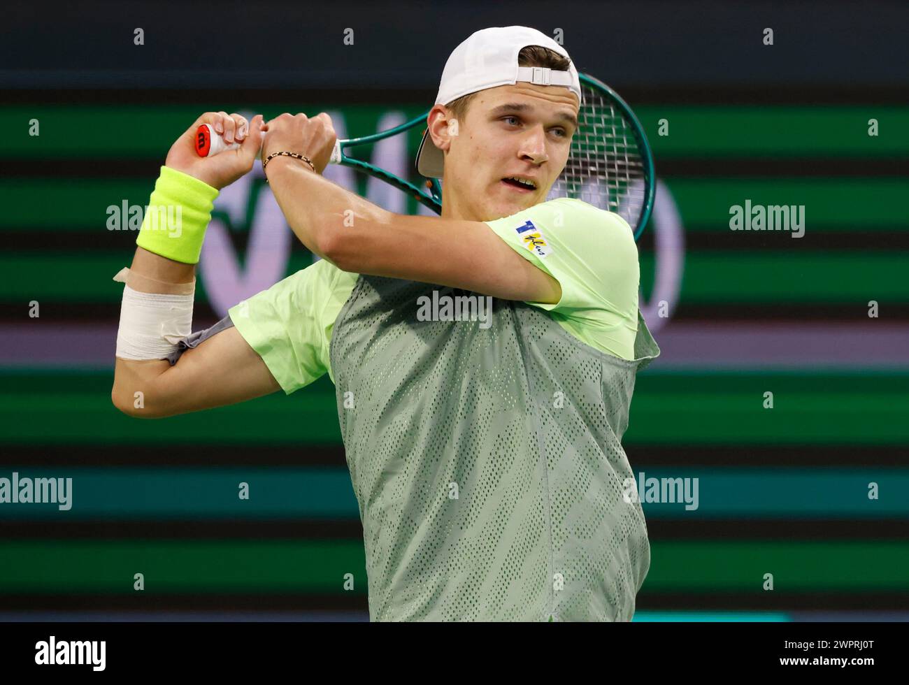 March 08, 2024 Jakub Mensik of the Czech Republic returns a shot ...