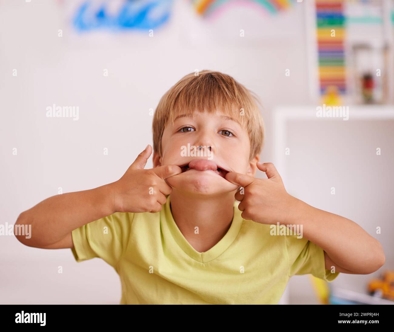 Boy, child and funny face with tongue out, goofy and playful in ...