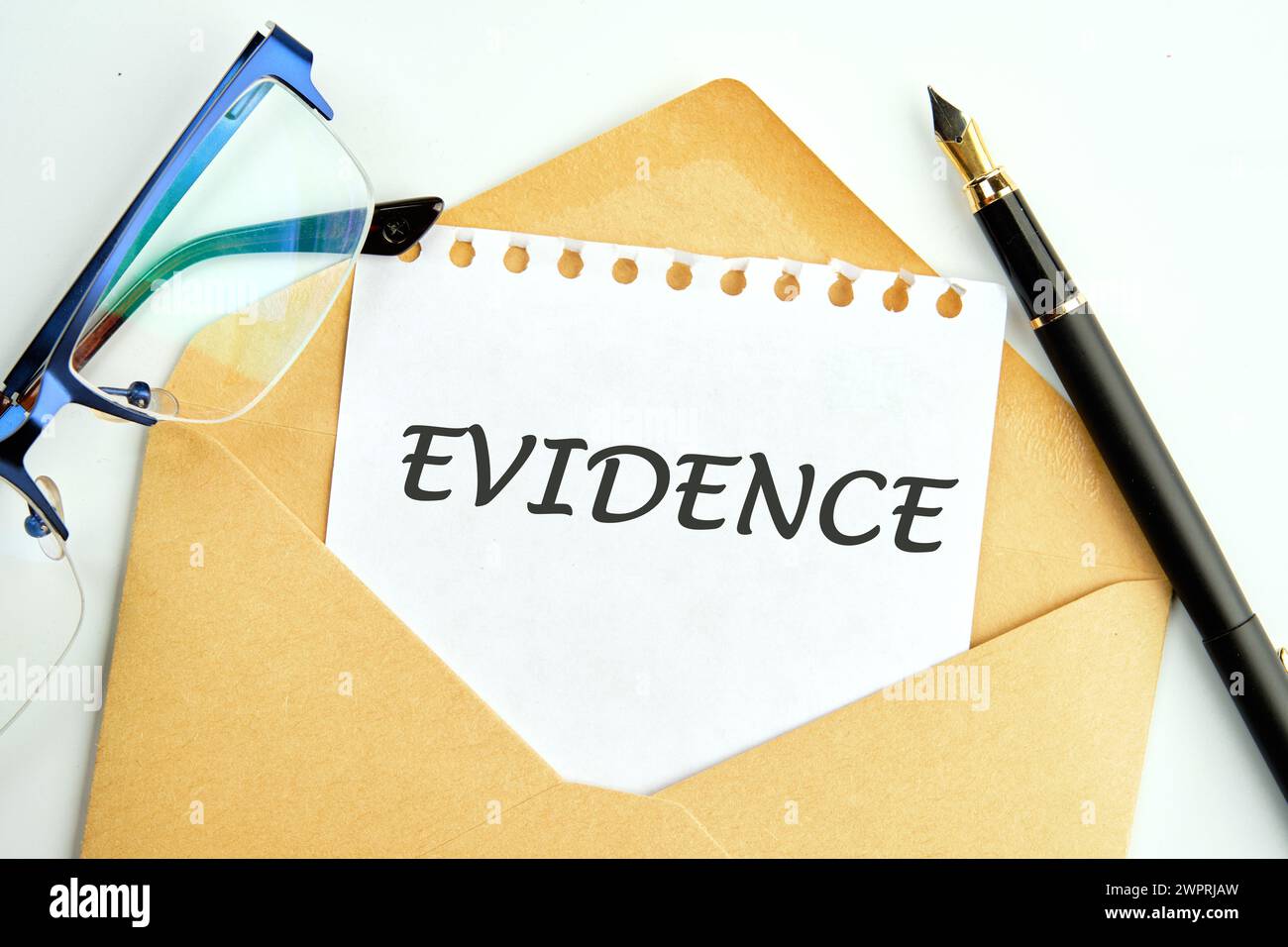 Word Evidence written on a sheet in an envelope Stock Photo - Alamy