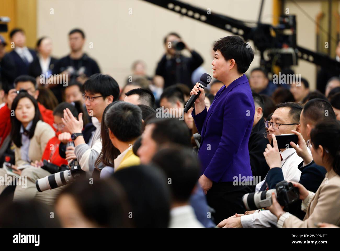 Beijing, China. 9th Mar, 2024. A journalist asks a question at a press conference on people's ...
