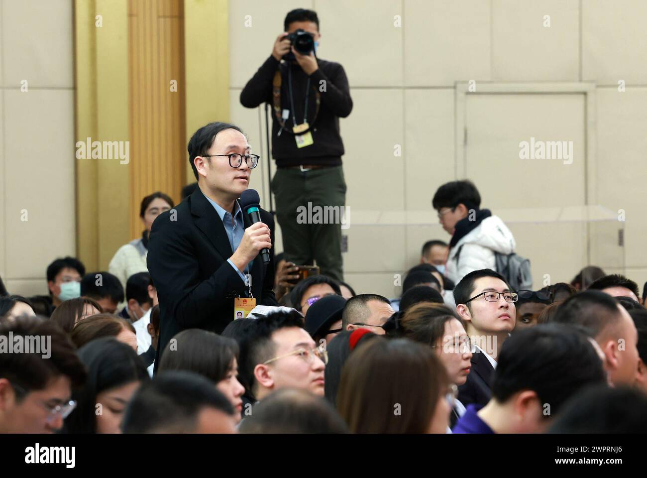 Beijing, China. 9th Mar, 2024. A journalist asks a question at a press conference on people's ...