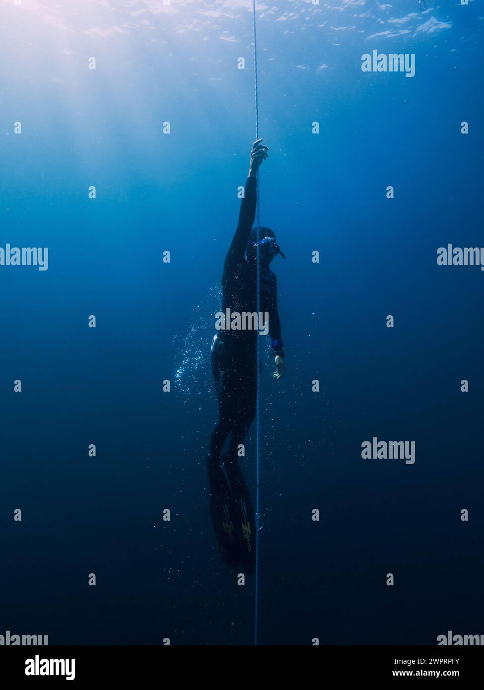 March 04, 2024. Nusa Penida, Indonesia. Men free diver in wetsuit ...
