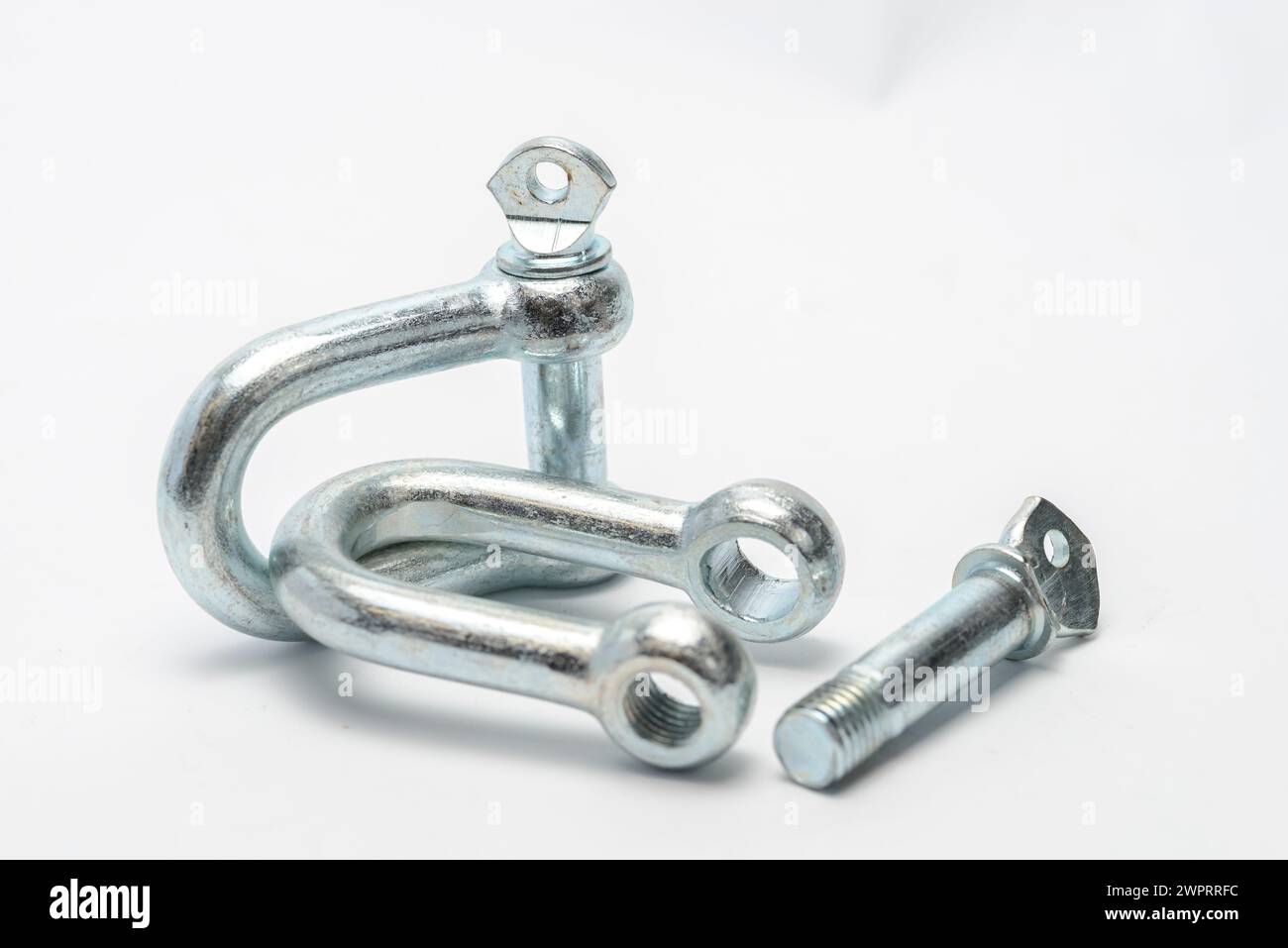 Threaded steel shackles on white background Stock Photo - Alamy