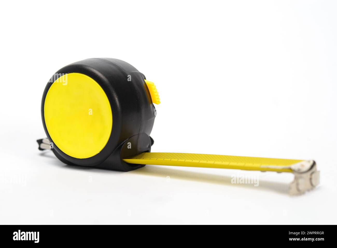 Retractable metal tape meter on white background Stock Photo - Alamy