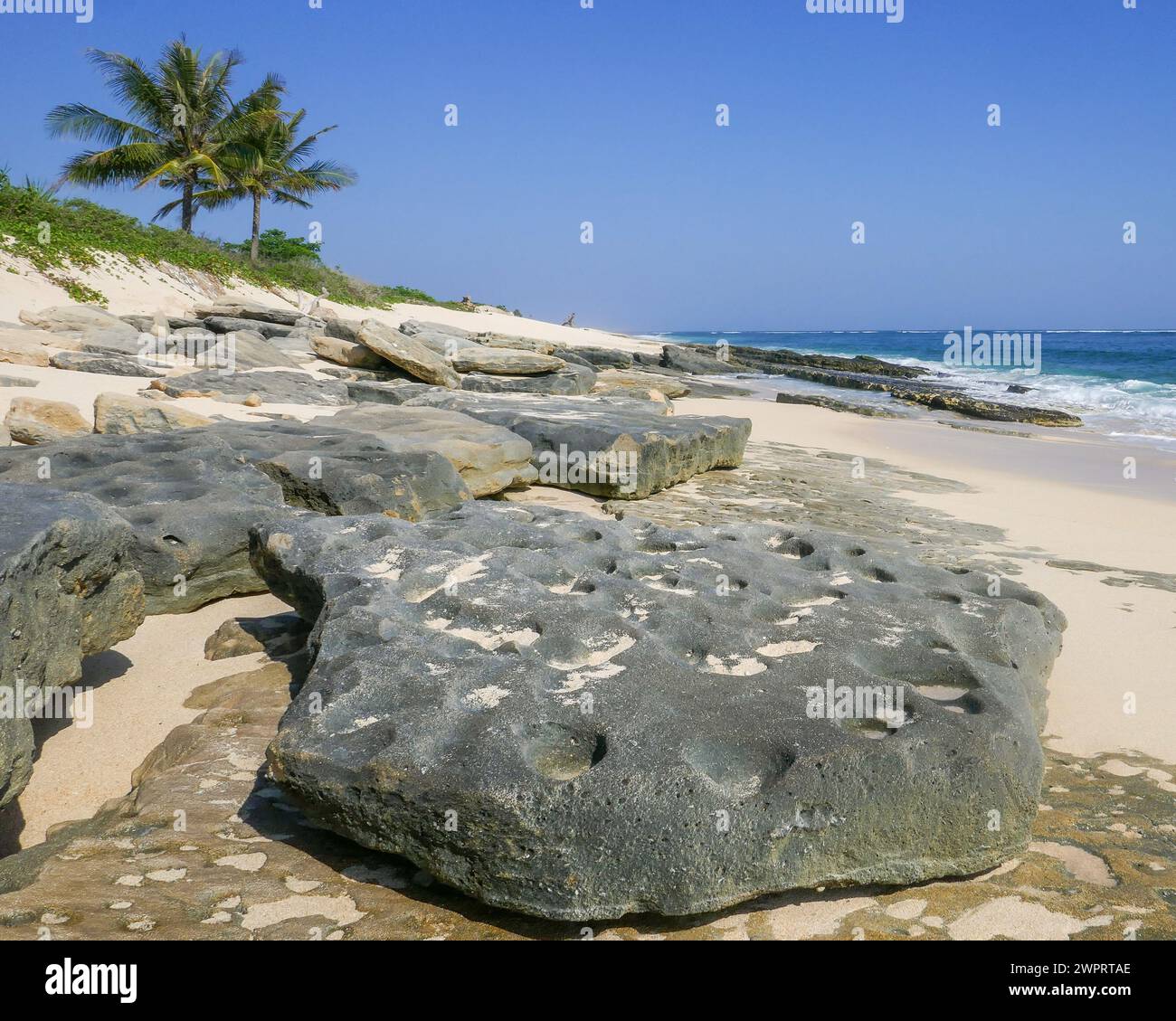 Landscape view of scenic Marosi beach with big eroded flat rocks ...