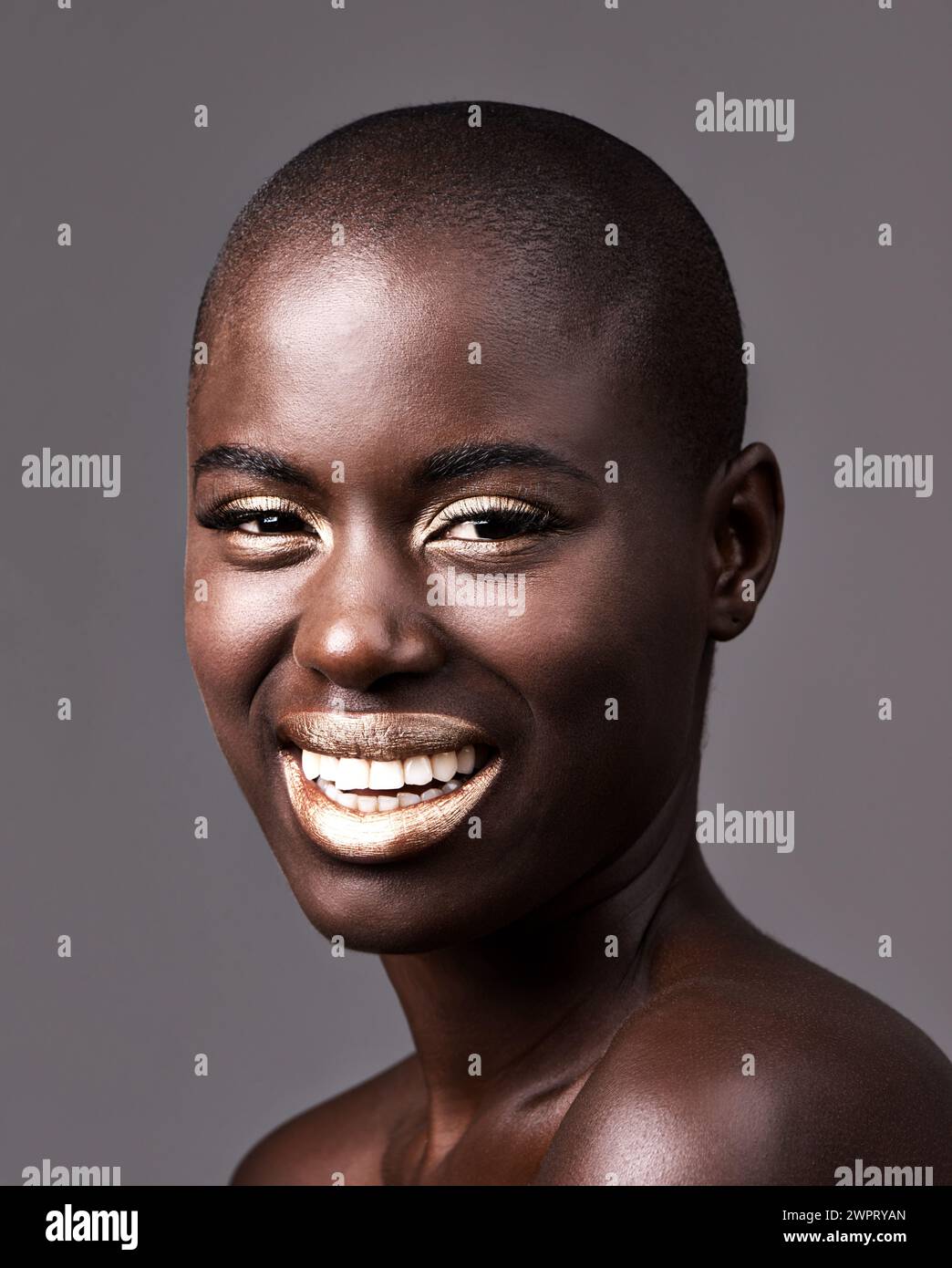 Portrait, skincare and makeup with bald black woman in studio on gray ...