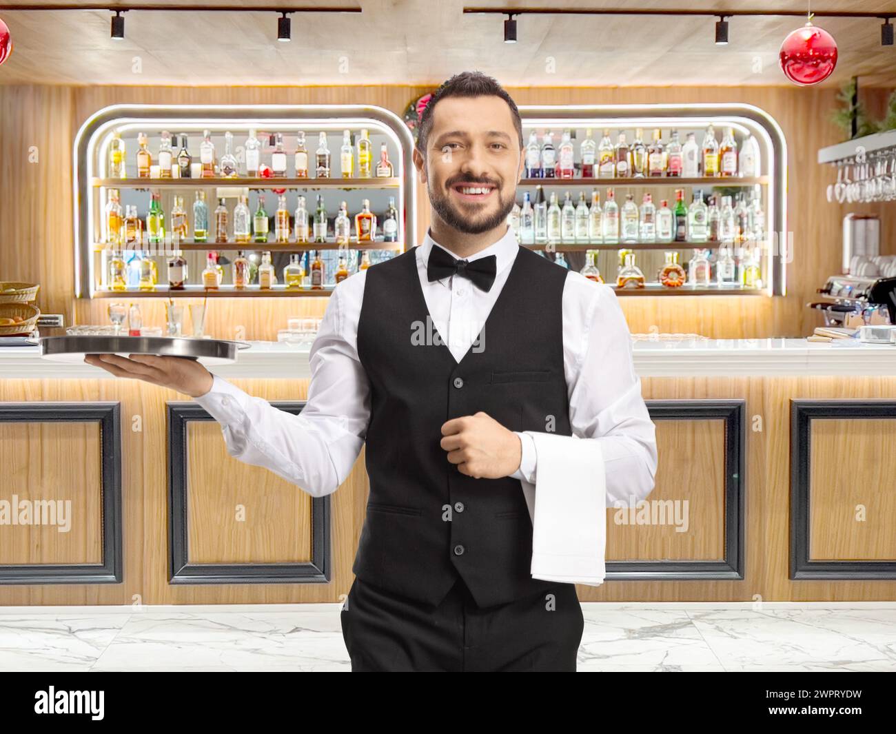 Waiter carrying silver tray hi-res stock photography and images - Alamy