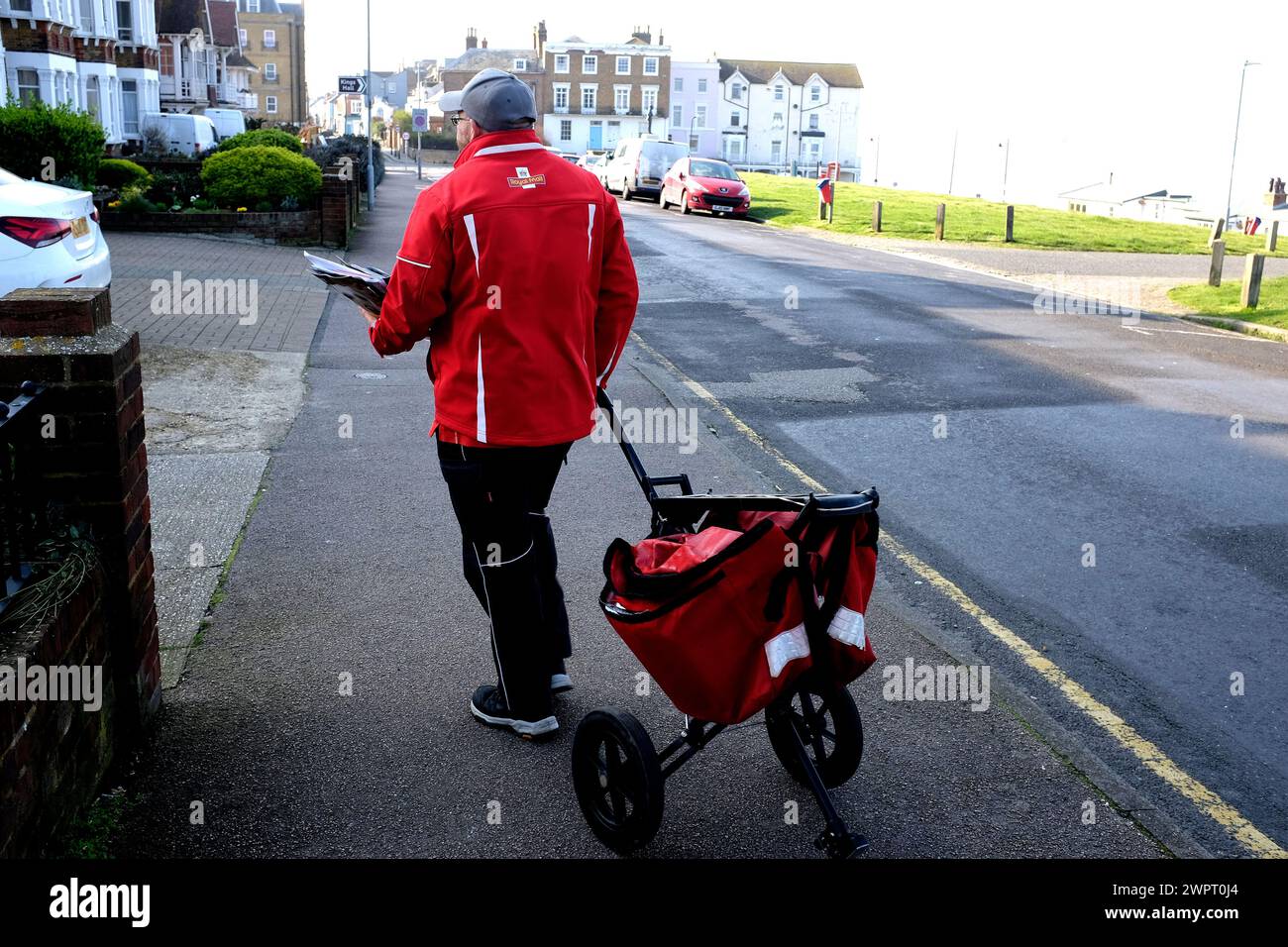 royal mail postman delivering post,herne bay town,east kent,uk march ...