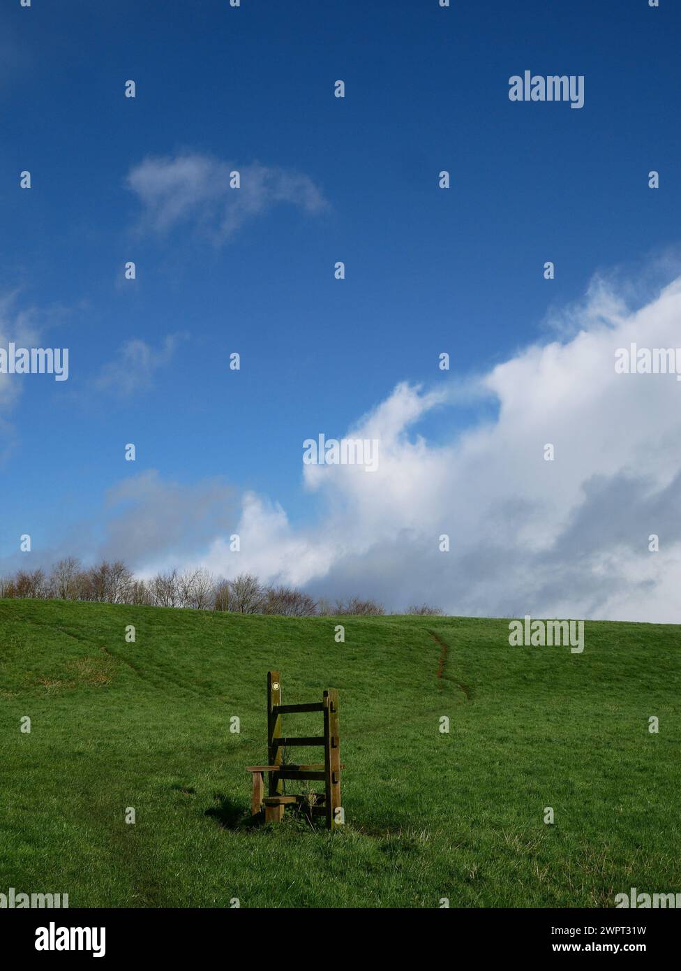 Wooden stile structure in farm field to facilitate walkers access along ...