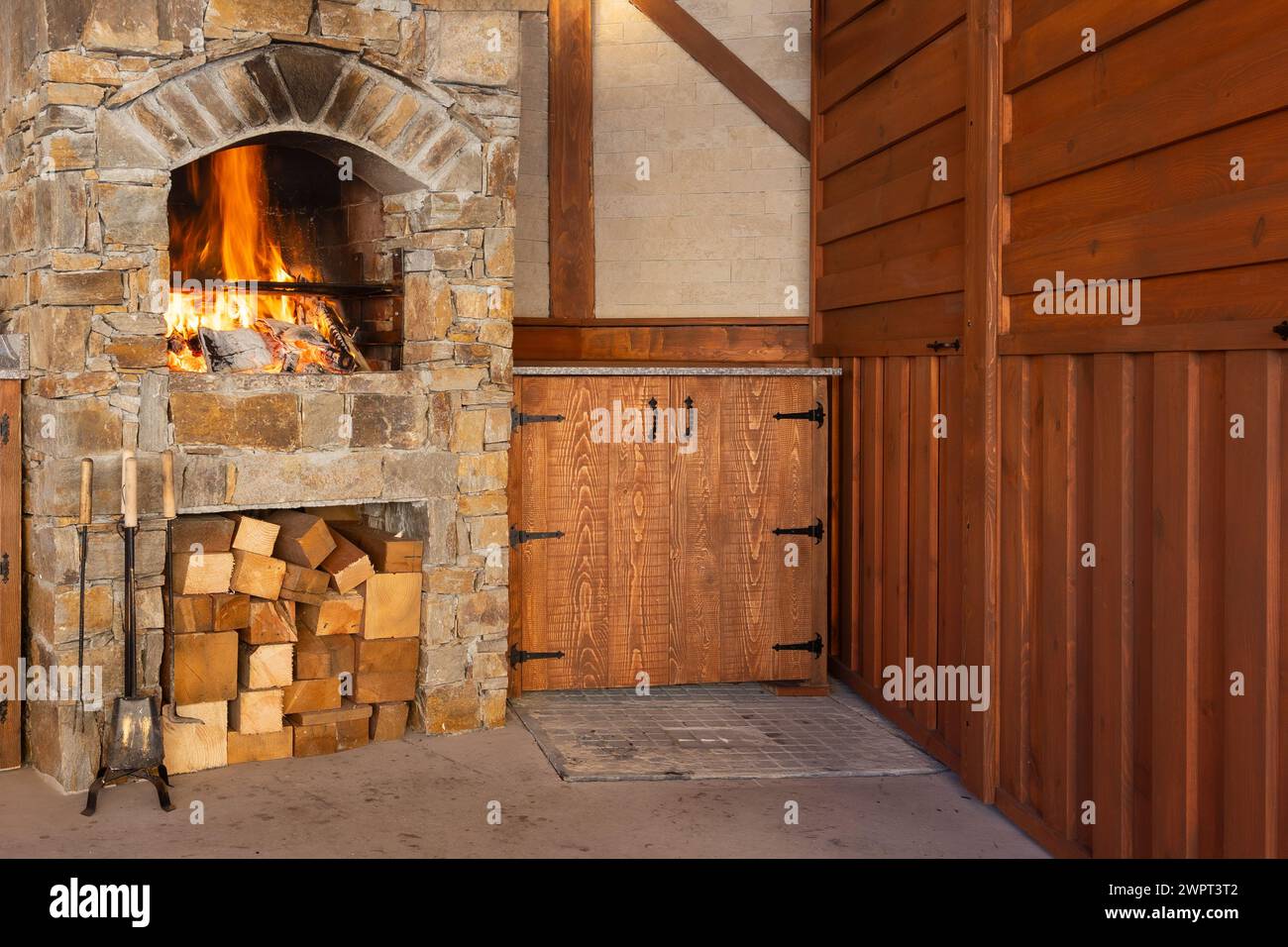 Oven with burning firewood for barbeque in restaurant kitchen Stock ...