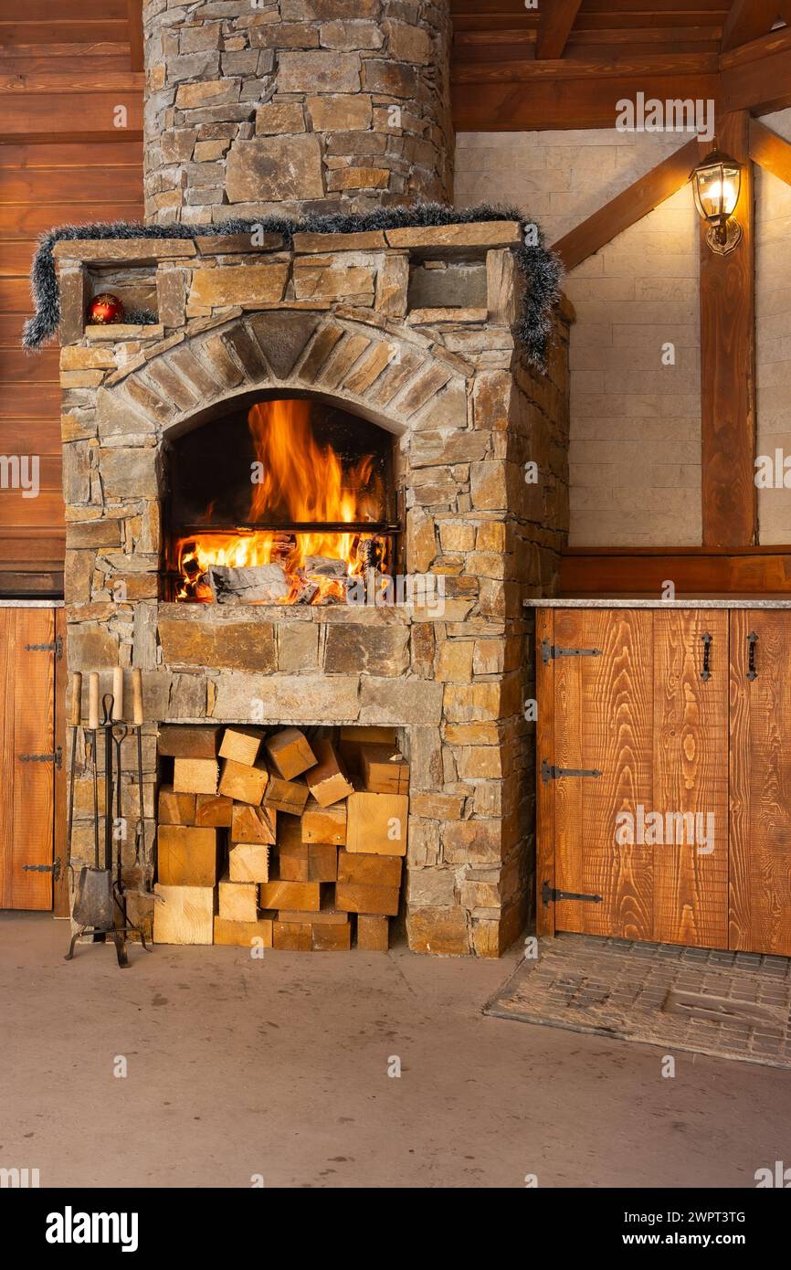 Oven with burning firewood for barbeque in restaurant kitchen Stock ...