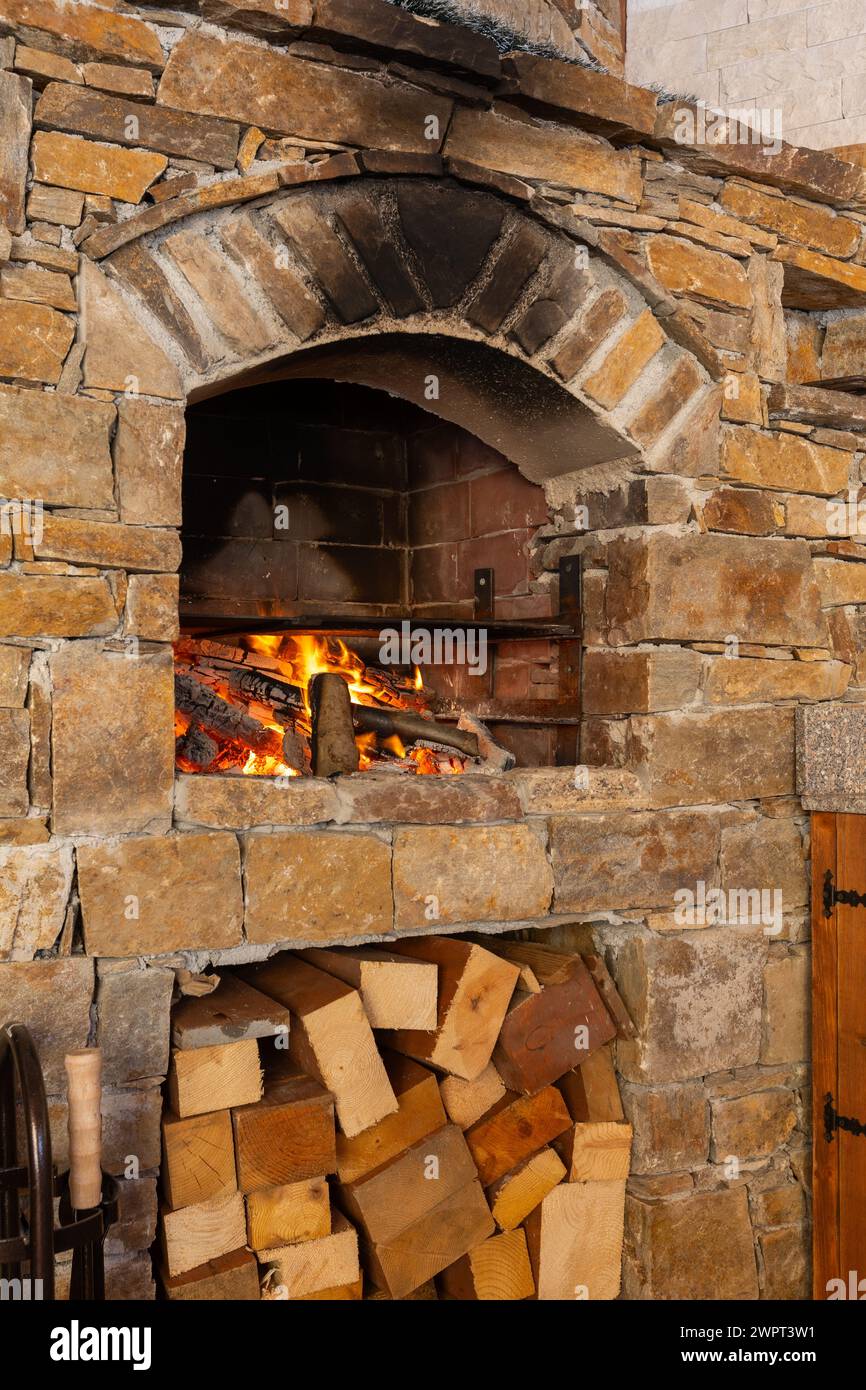 Oven with burning firewood for barbeque in restaurant kitchen Stock ...