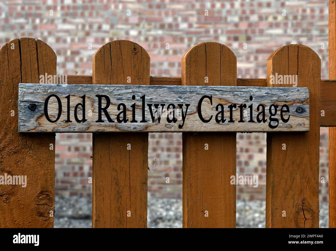 old railway carriage sign on front gate Stock Photo - Alamy