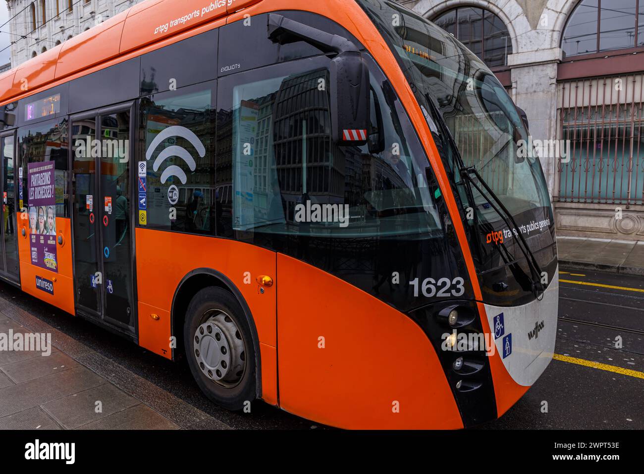 Geneva, Switzerland - April 1, 2018: A red bus at a stop on a street in ...
