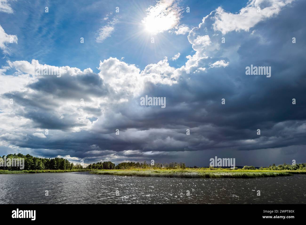 Dramatic changeable weather on the lake with cloudy sky, sun, cloud ...