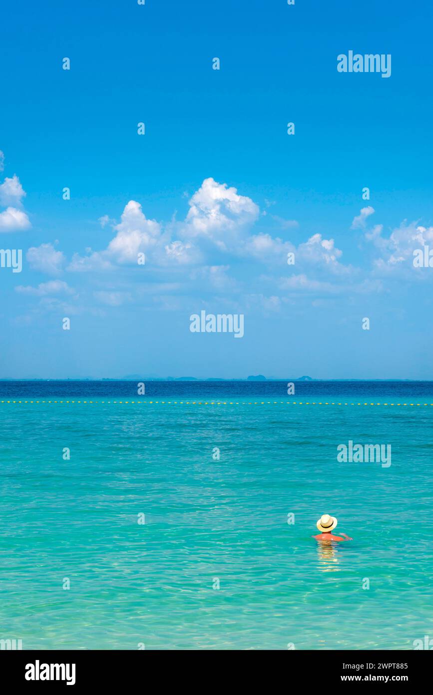 Man with hat bathing in the sun in the sea, ocean, Andaman Sea, ozone ...