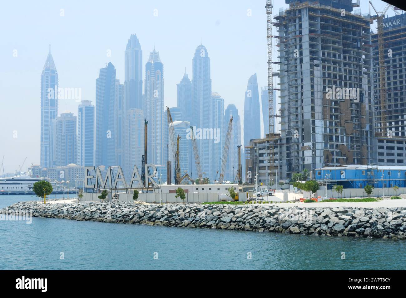 The busy Dubai Marina area overlooking the EMAAR sign, with ongoing ...