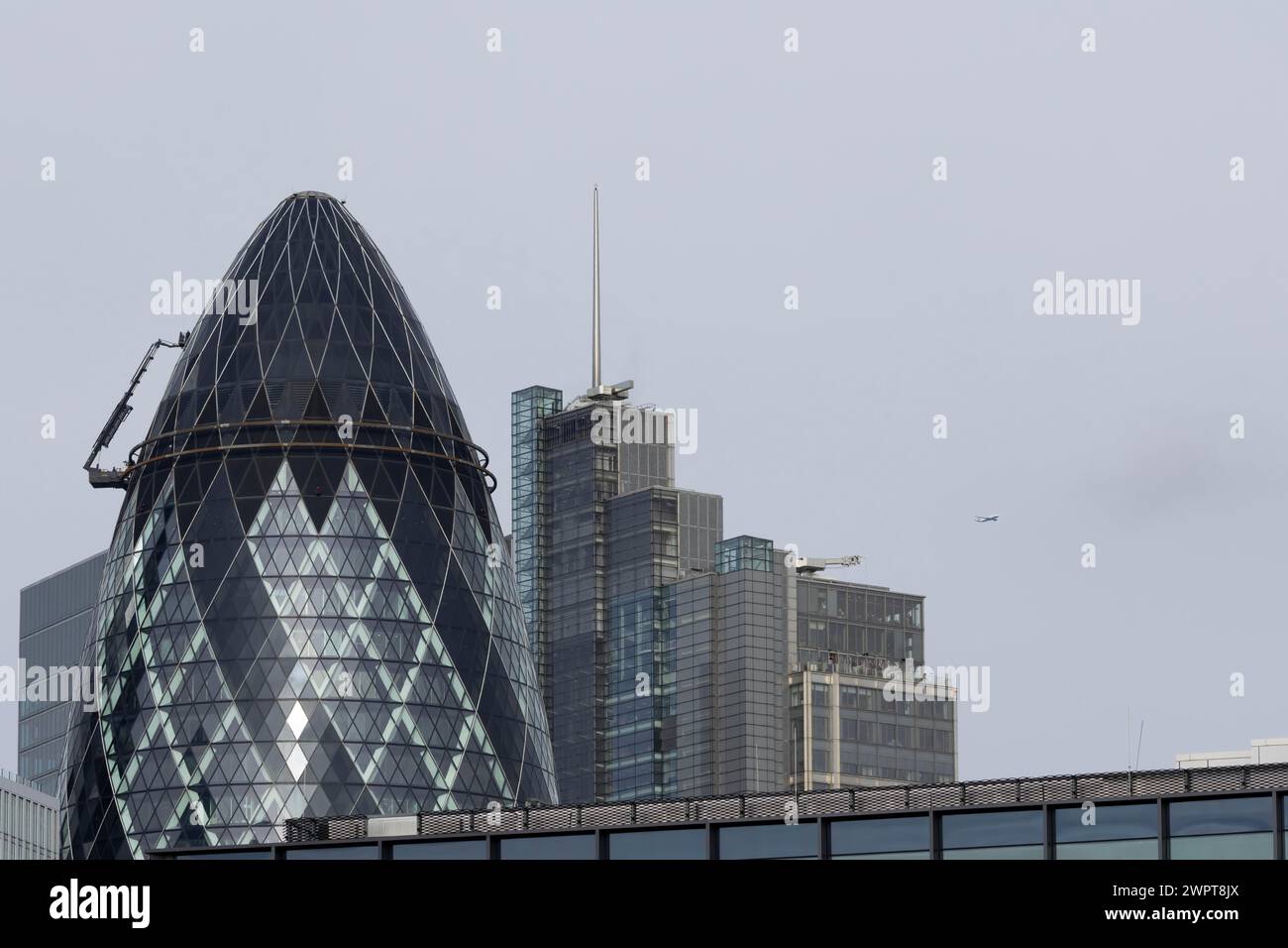 The Gherkin skyscraper building and nearby high rise office building ...
