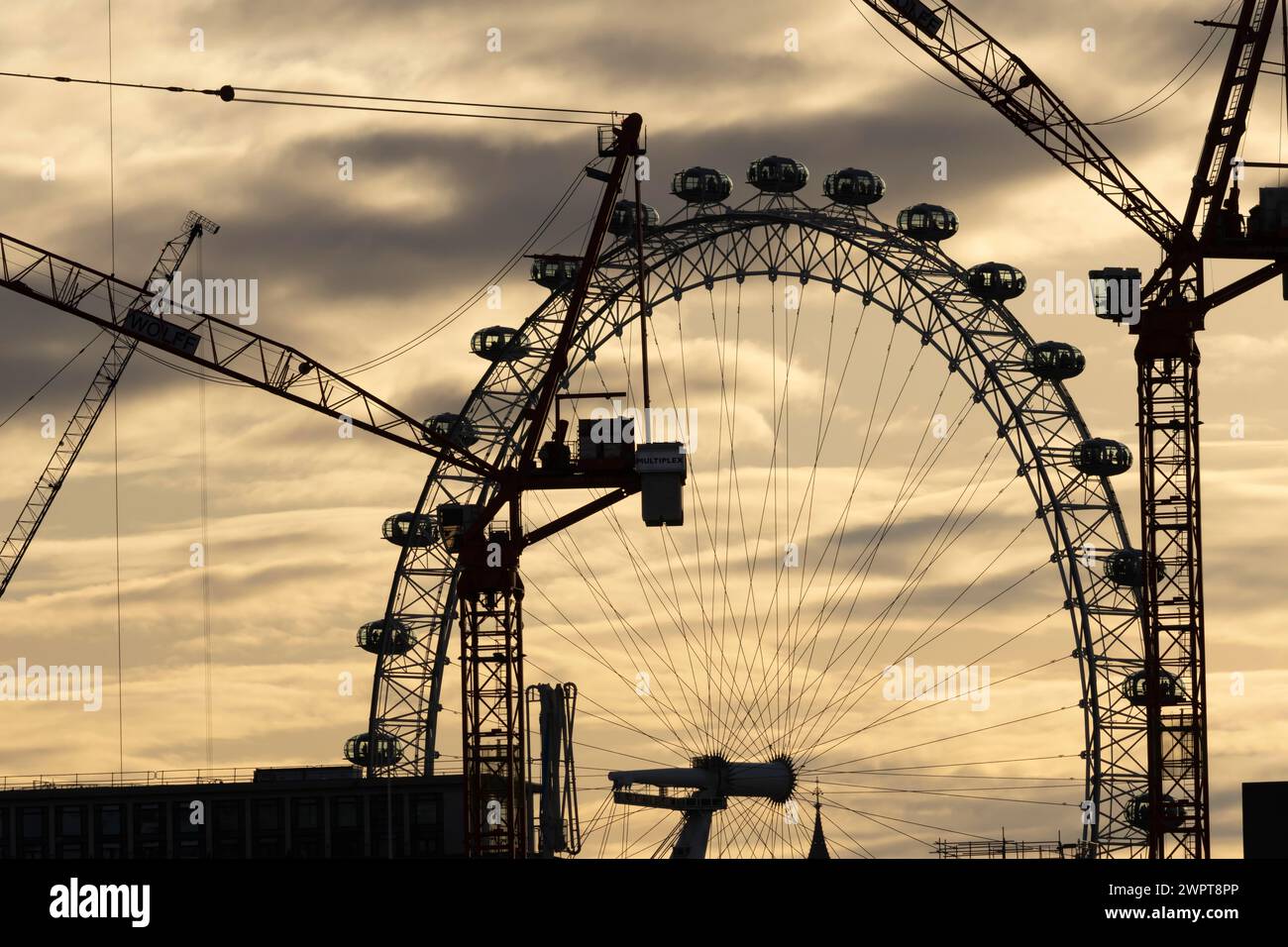 London Eye or Millennium Wheel tourist observation wheel at sunsetwith ...