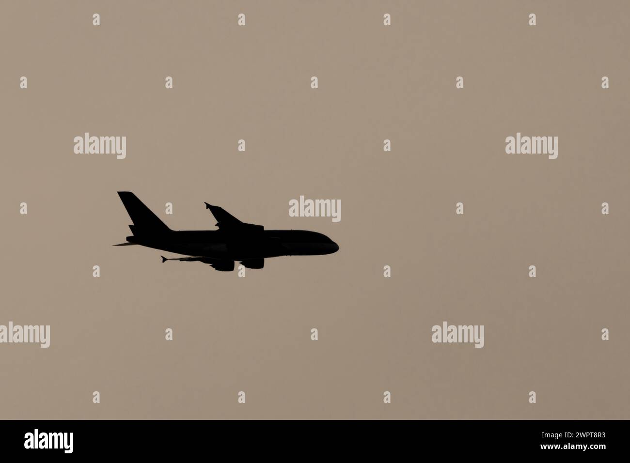 Airbus A380 aircraft in flight silhouette at sunset, England, United ...