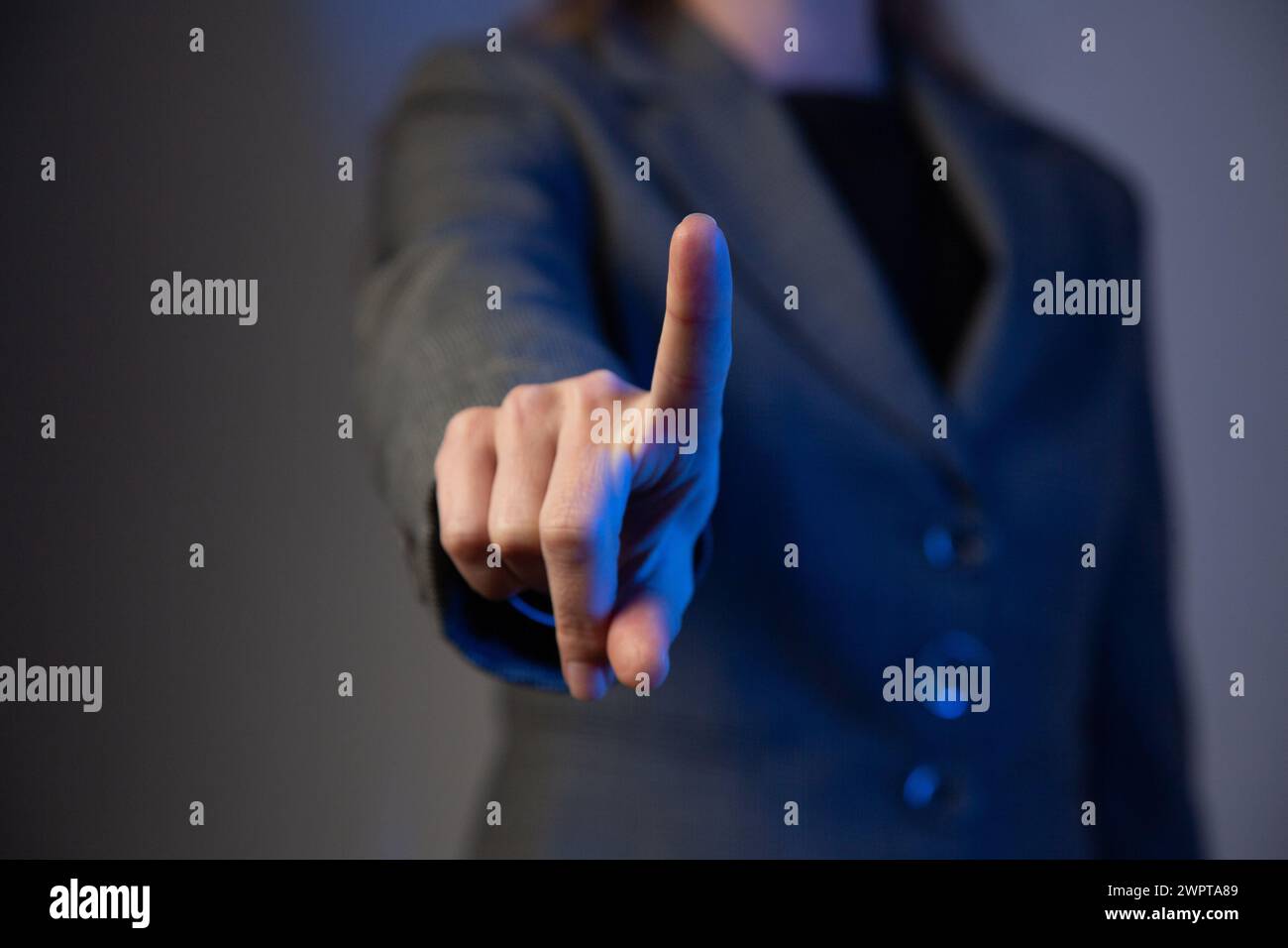 Portrait of a business woman with her arm extended forward and her ...