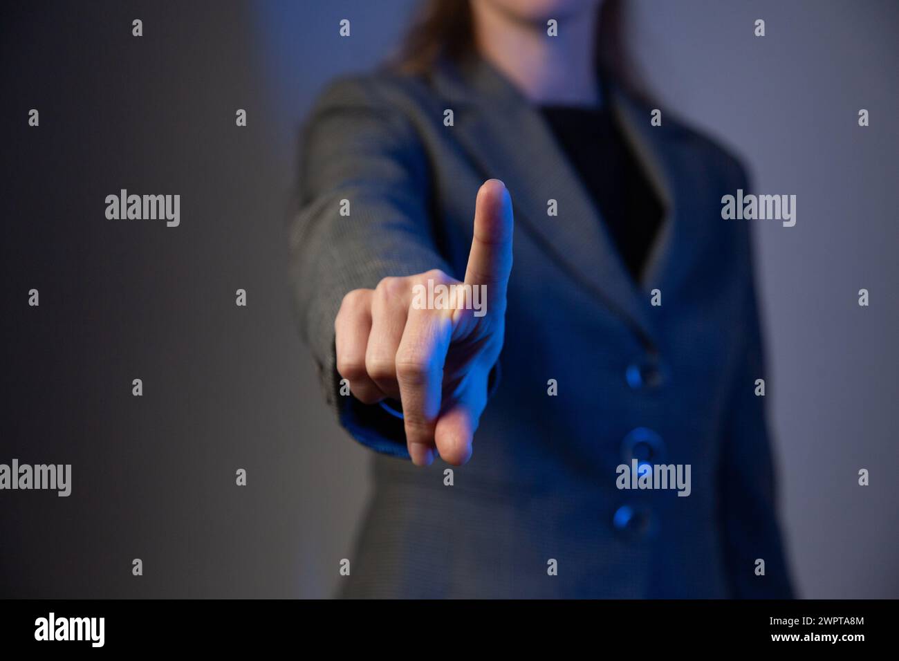 Portrait of a business woman with her arm extended forward and her ...