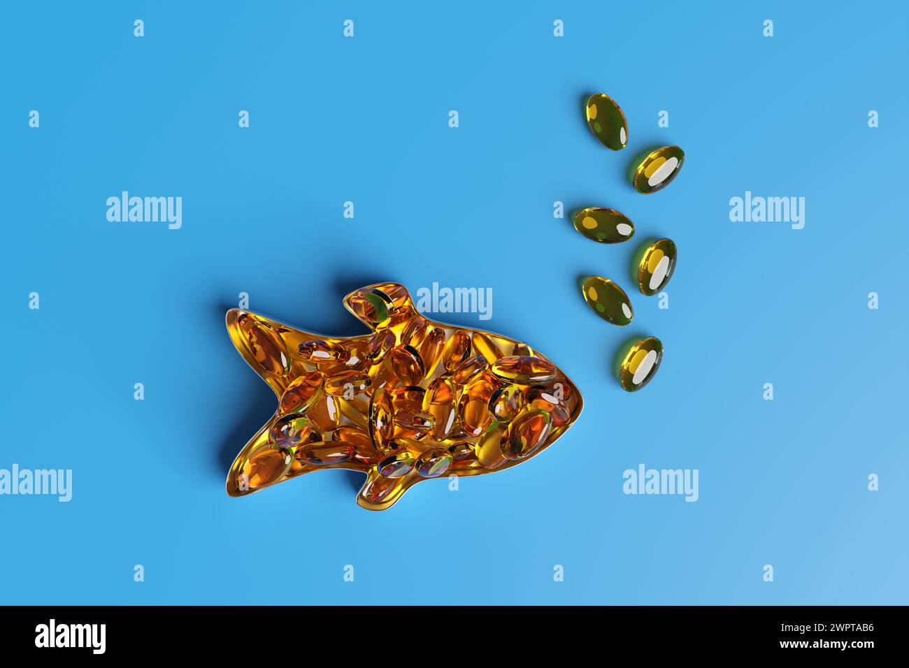 Fish shaped tin box filled with orange elliptical fish oil pills and ...