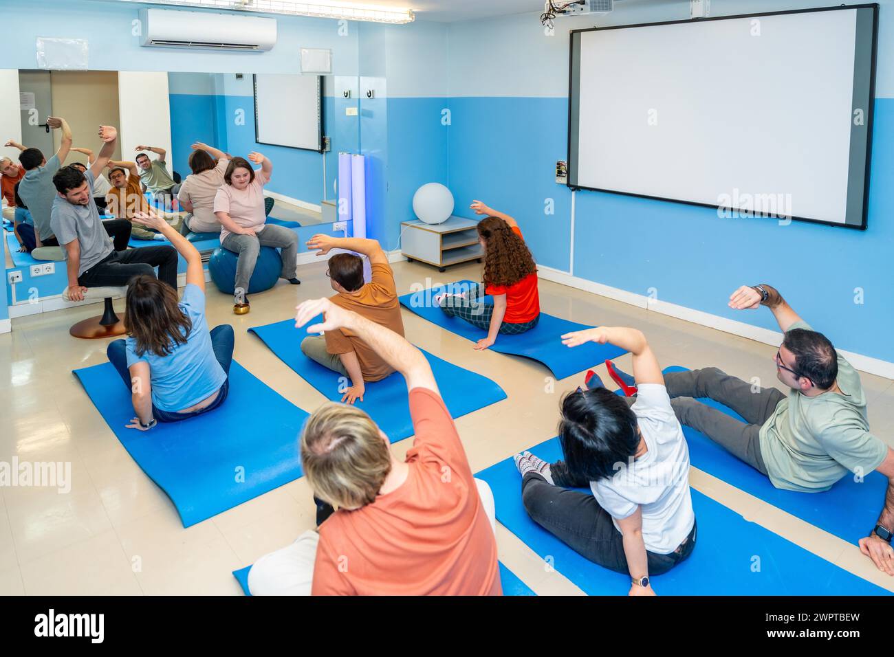 Elevated rear view of a group of male and female disabled people ...